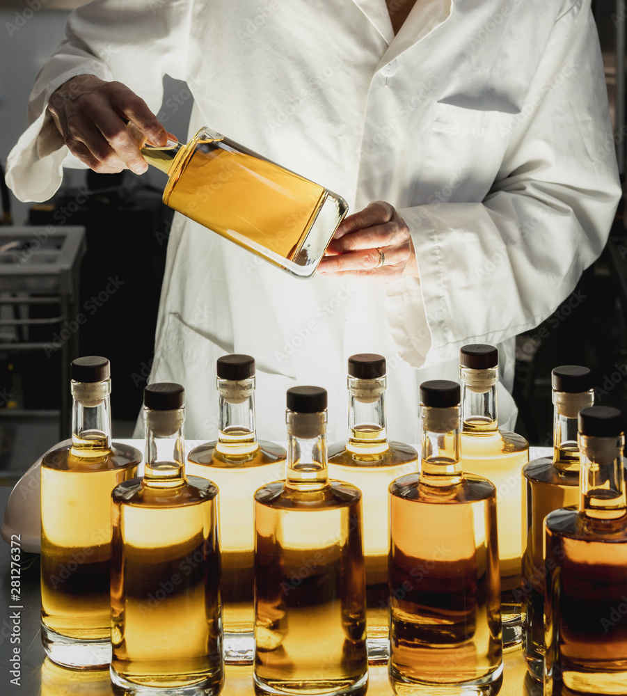 Foto de Small liquor production based on maple syrup. Lot of pure ...
