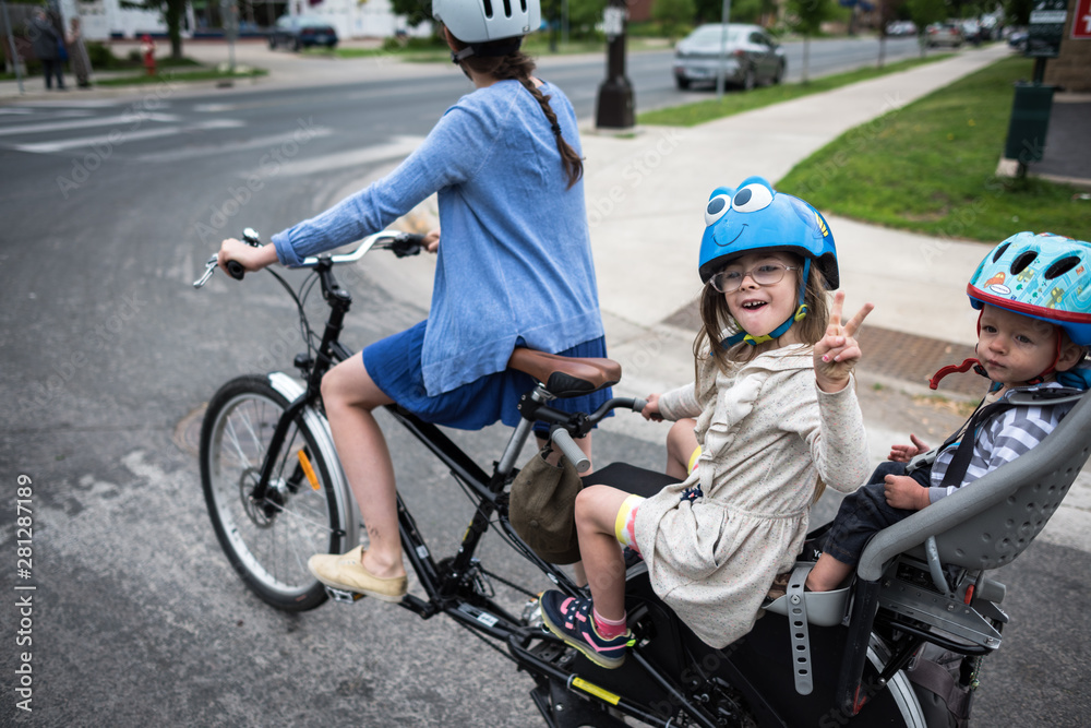 Mom Bikes With Kids on Cargo Bike Stock Photo | Adobe Stock