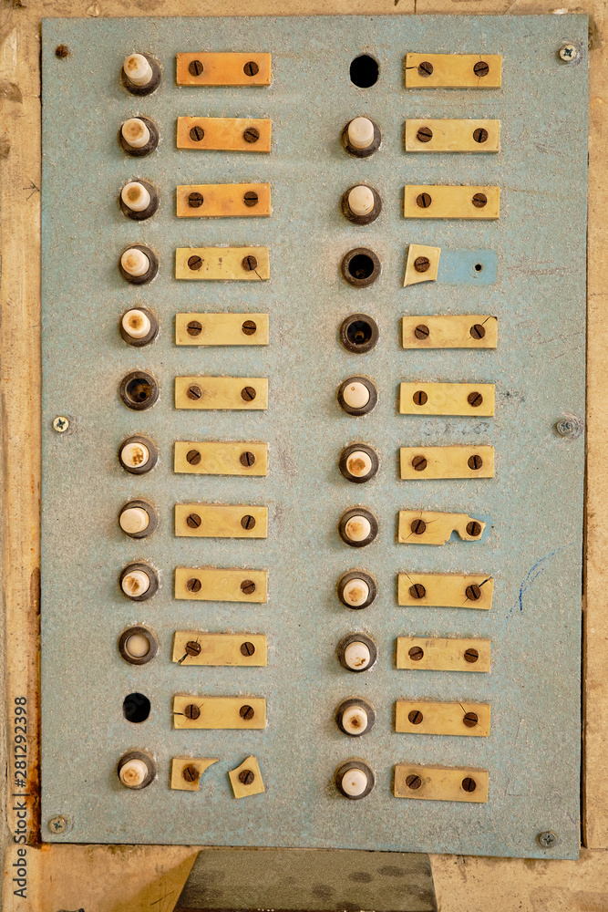 Vintage building call button panel, with broken buttons and nameless ...