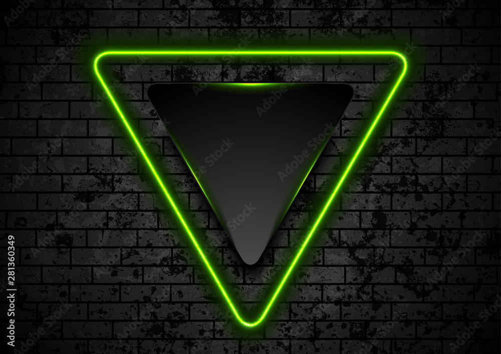 Green neon luminous triangle on dark grunge brick wall background ...