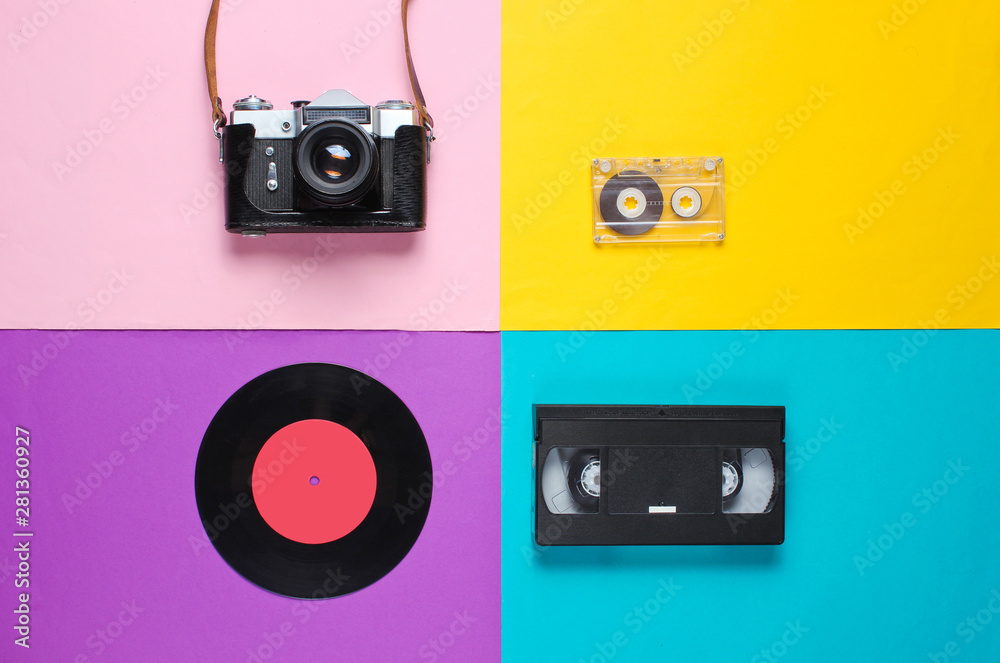 Retro top view still life. Vinyl record, vintage film camera, video and ...