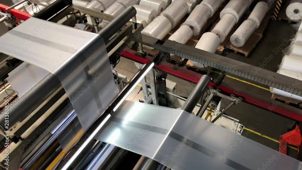 footage of plastic and flexible polymer packaging production; modern ...