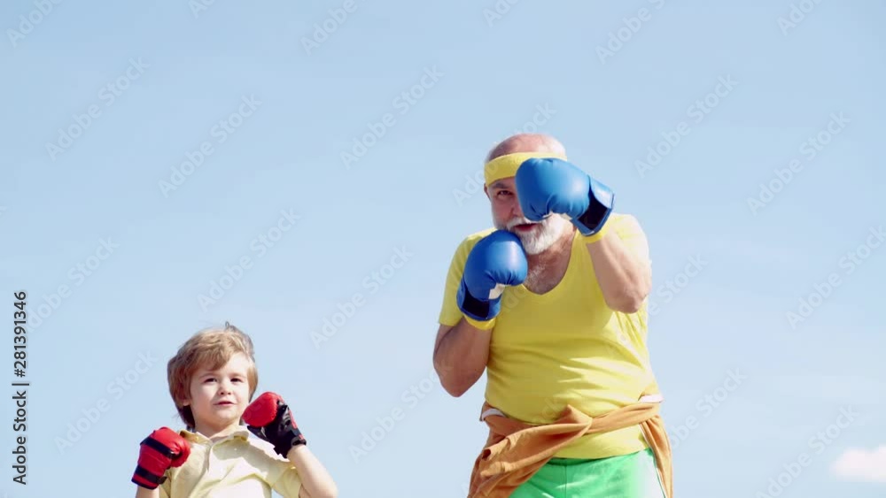 Grandfather and child fighting poses. Grandpa and little child boy in ...
