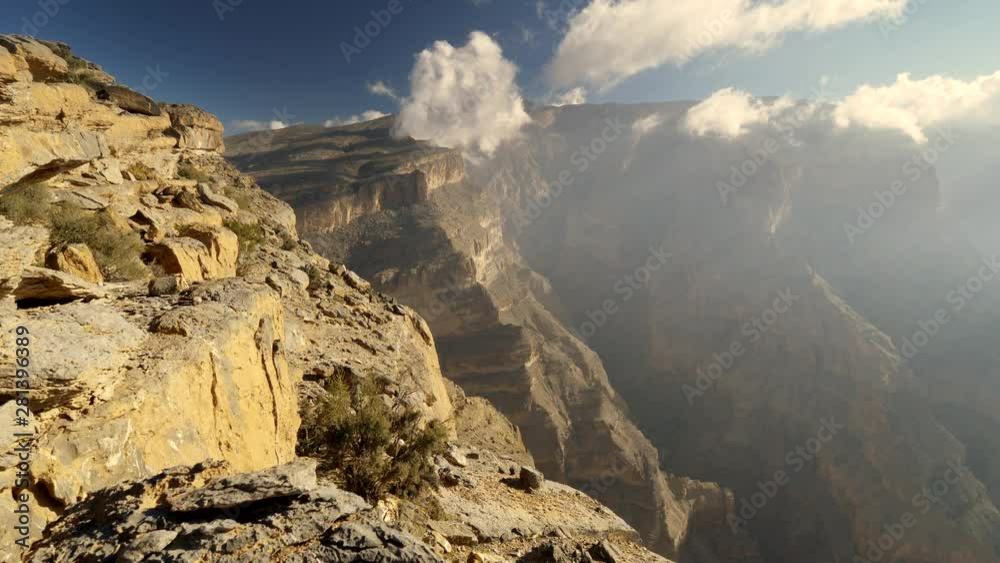 Mount Jebel Shams, Oman. The near part has great yellow stones and the ...