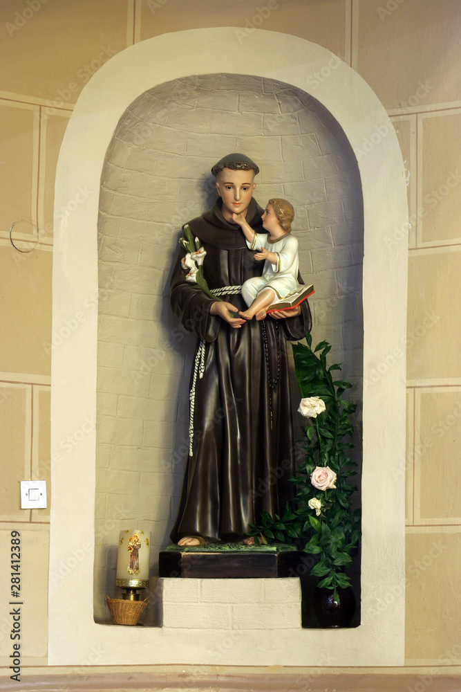Saint Anthony of Padua holding child Jesus, statue in the church of the ...