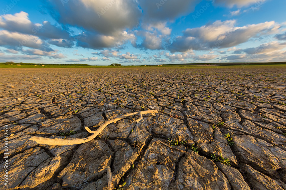 Arid and dry cracked land due to climate change and global warming - An ...