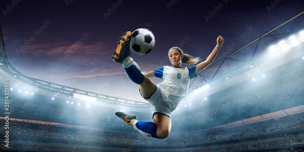 Female Soccer player in action on a professional soccer stadium. Girl ...