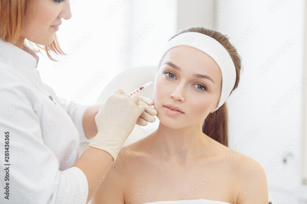 Unidentified master cosmetologist makes botox injections into the ...