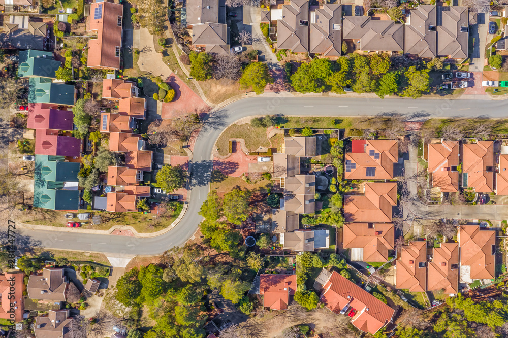Aerial view of streets and rooftops in the suburb of Holt in Canberra ...