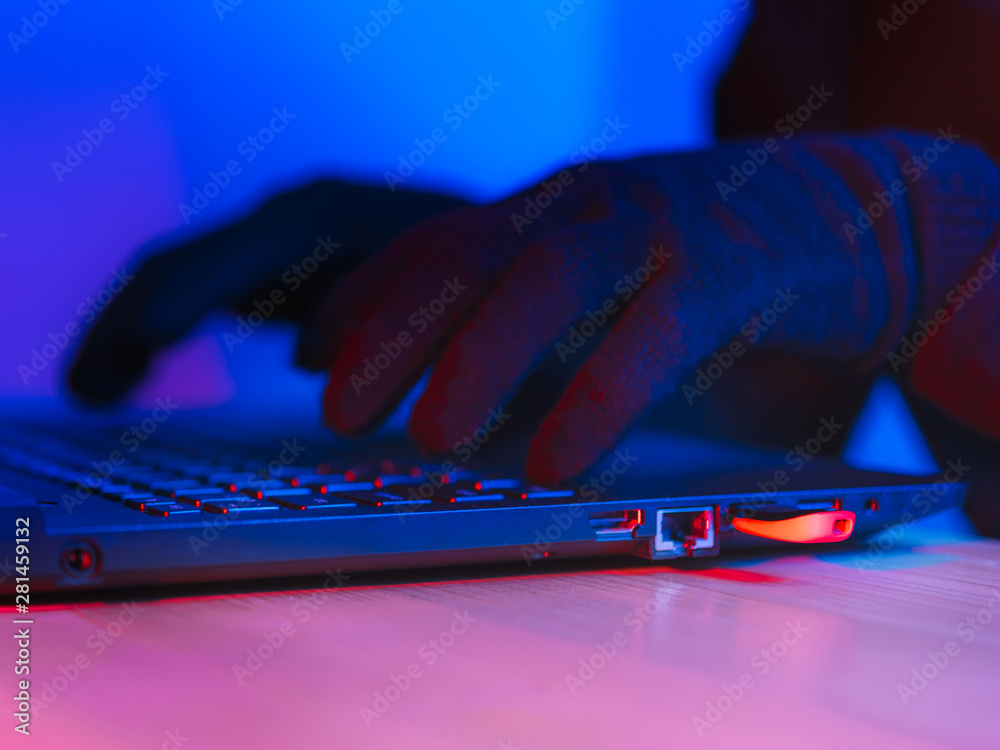 Online theft of personal data, computer hacking. Hacker man using a ...