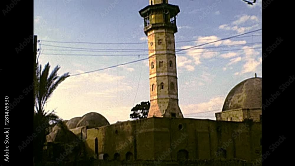 Streets life of the old town with Great Mosque of Gaza city. Archival ...