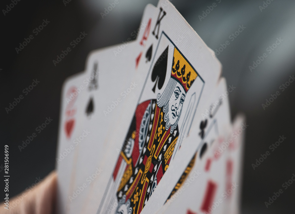 Perspective of hand of cards with king of spades in focus Stock Photo ...