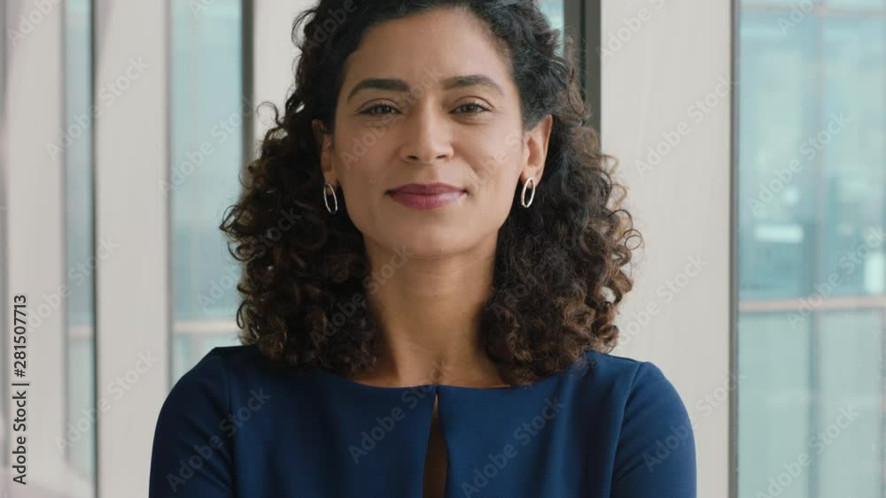 portrait confident business woman smiling with arms crossed successful ...