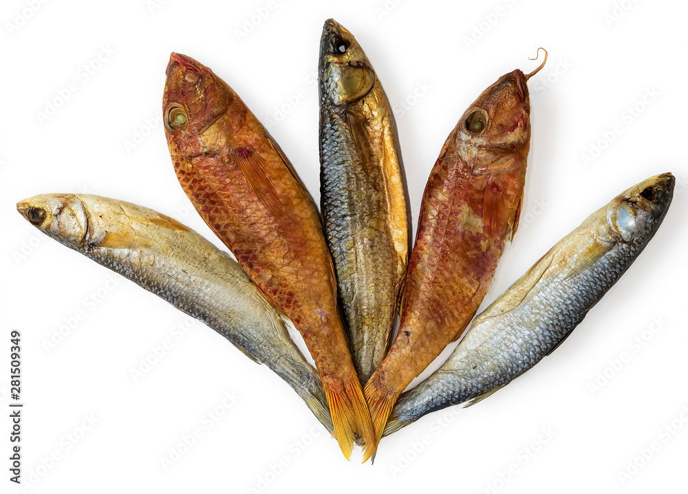 Dried fishes - Mullus and Mugil - on the table. Salty dry fish on a ...