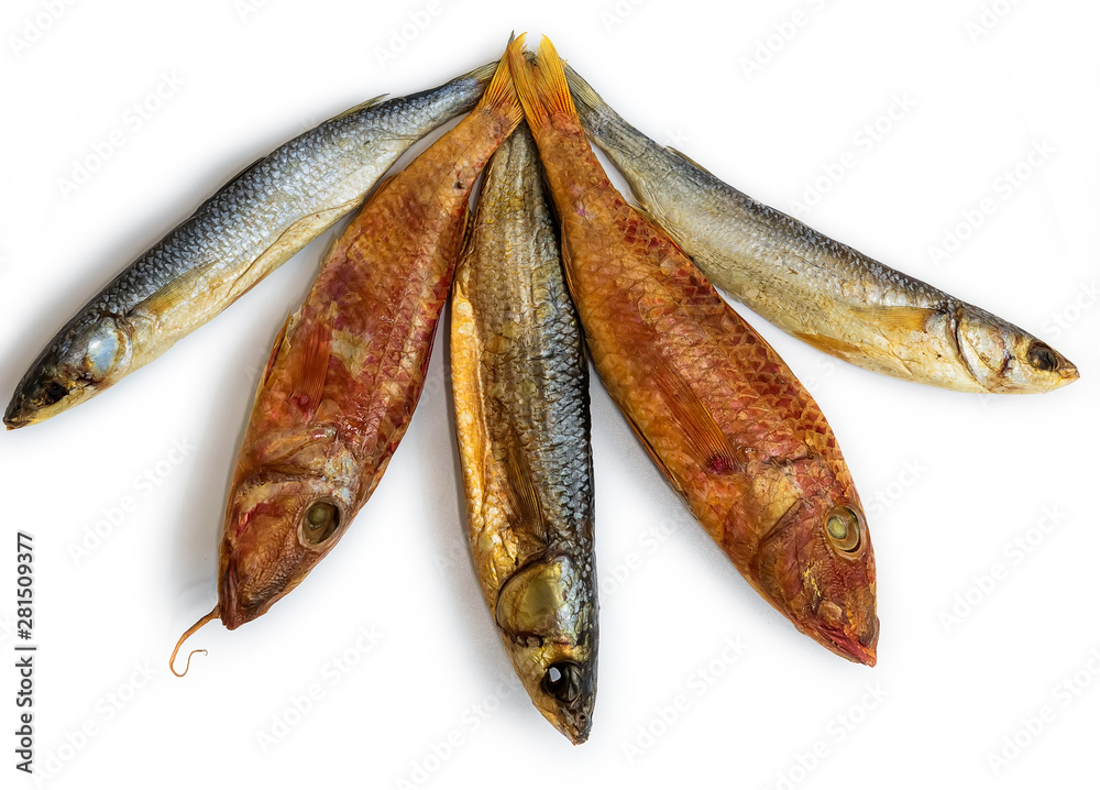 Dried fishes - Mullus and Mugil - on the table. Salty dry fish on a ...