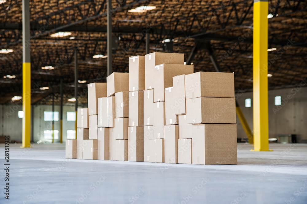 Stack of cardboard boxes in warehouse Stock Photo | Adobe Stock