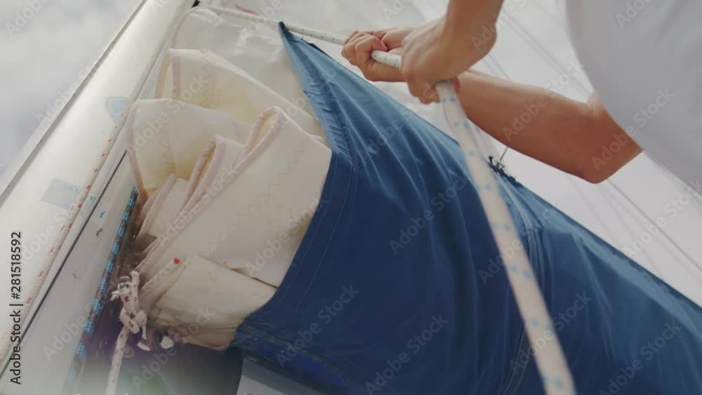 to Meet the Wind Hand pulls the Rope of marine equipment on sailing ...