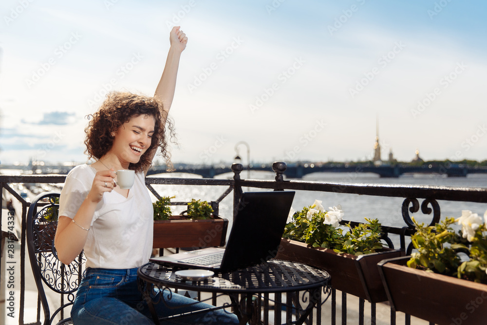 Cute happy young girl working on computer and smiling. Beautiful woman ...