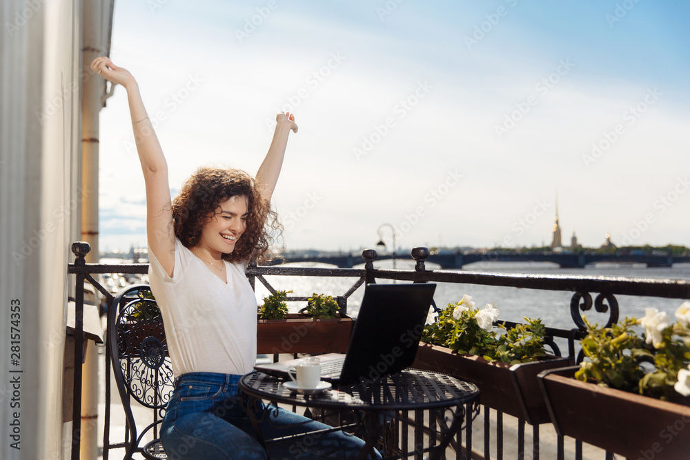 Cute happy young girl working on computer and smiling. Beautiful woman ...