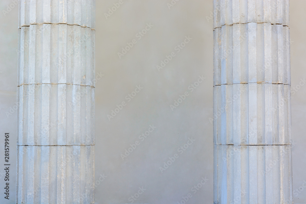 Two white columns on a wall background. Scenery. Stock Photo | Adobe Stock