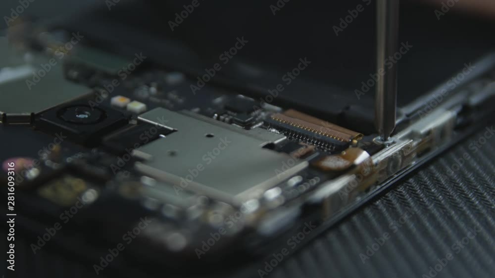 Close-up shot showing the process of cell phone repairing. Hands of ...