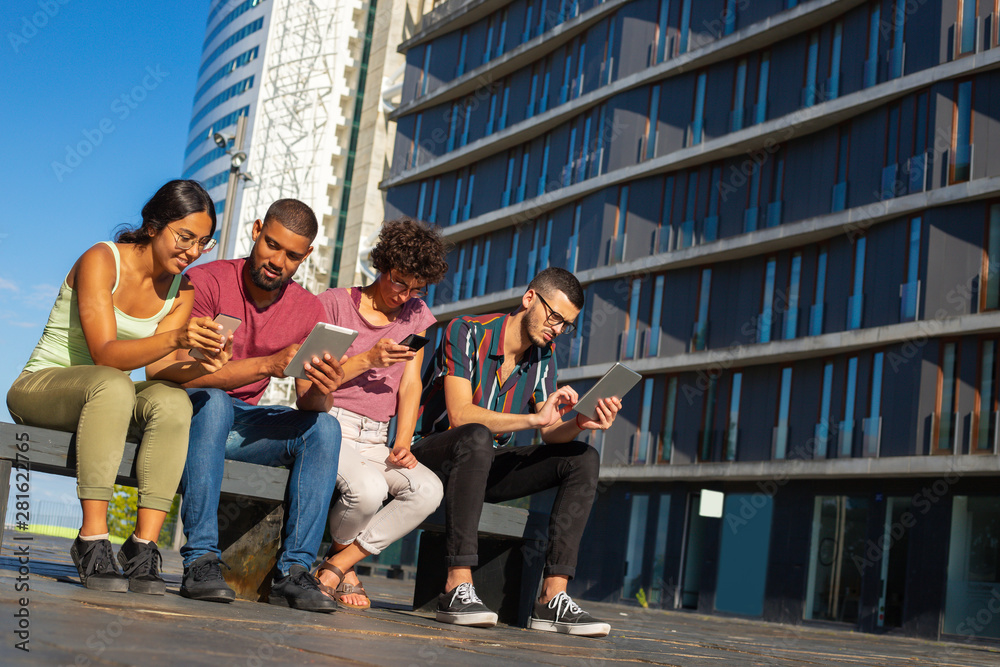 People Using Smartphones And Tablets