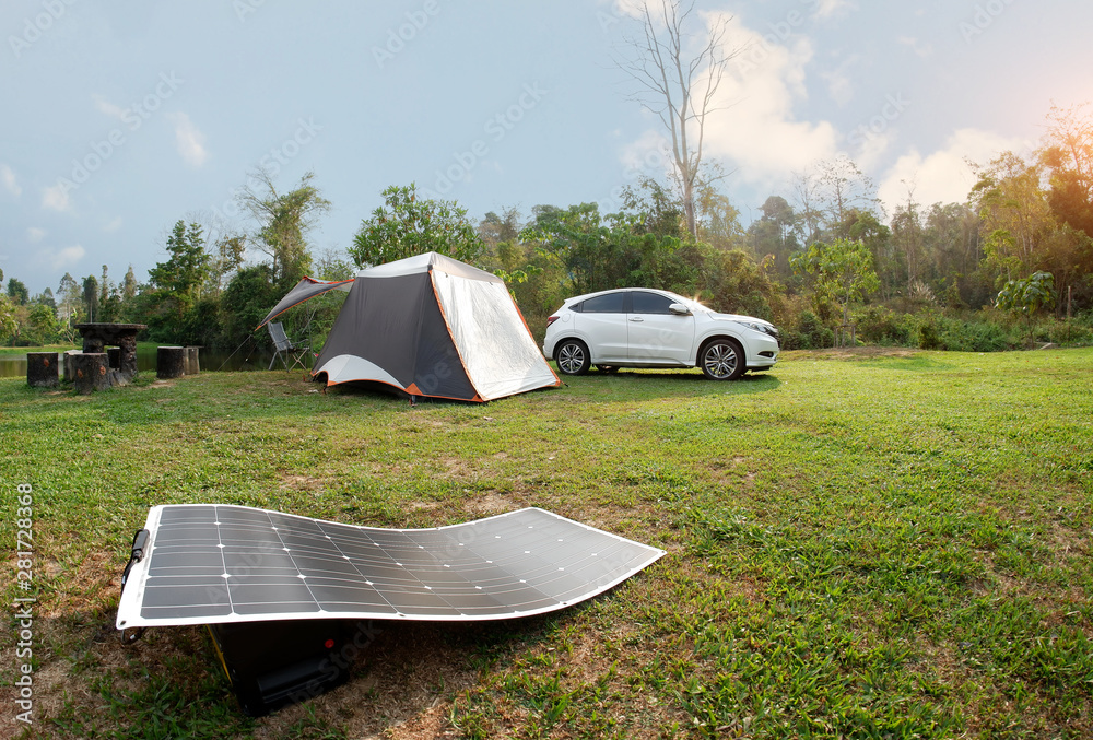 Solar panels or Solar cells energy and tents camping. Stock Photo ...
