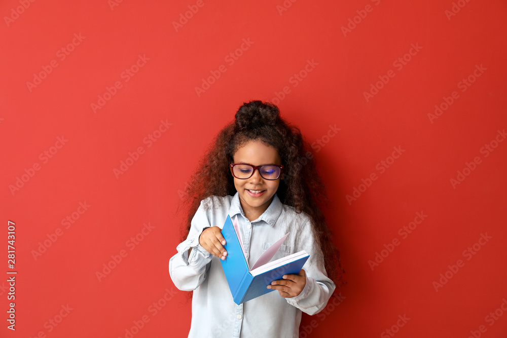 African-American girl with book on color background Stock Photo | Adobe ...