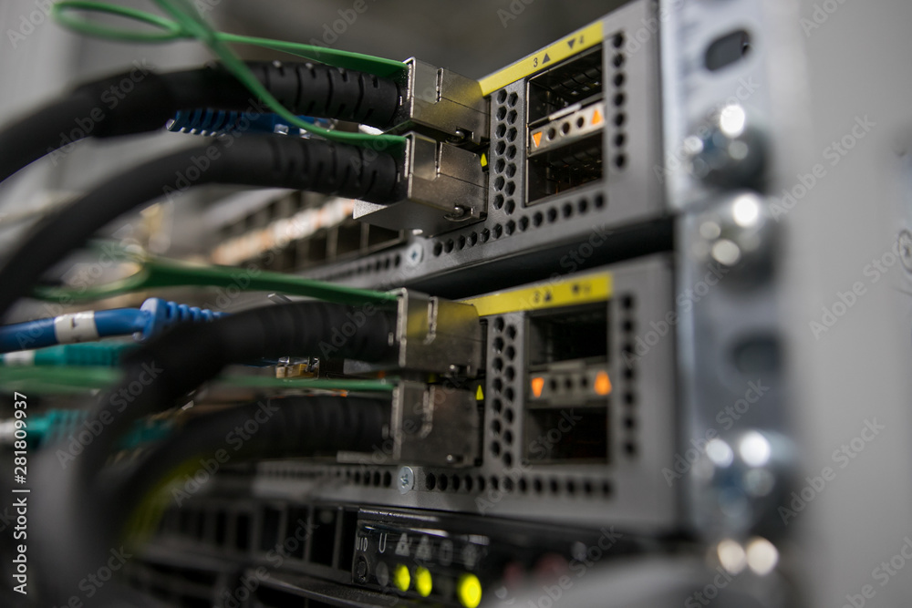 Server rack with red internet patch cord cables connected to patch ...