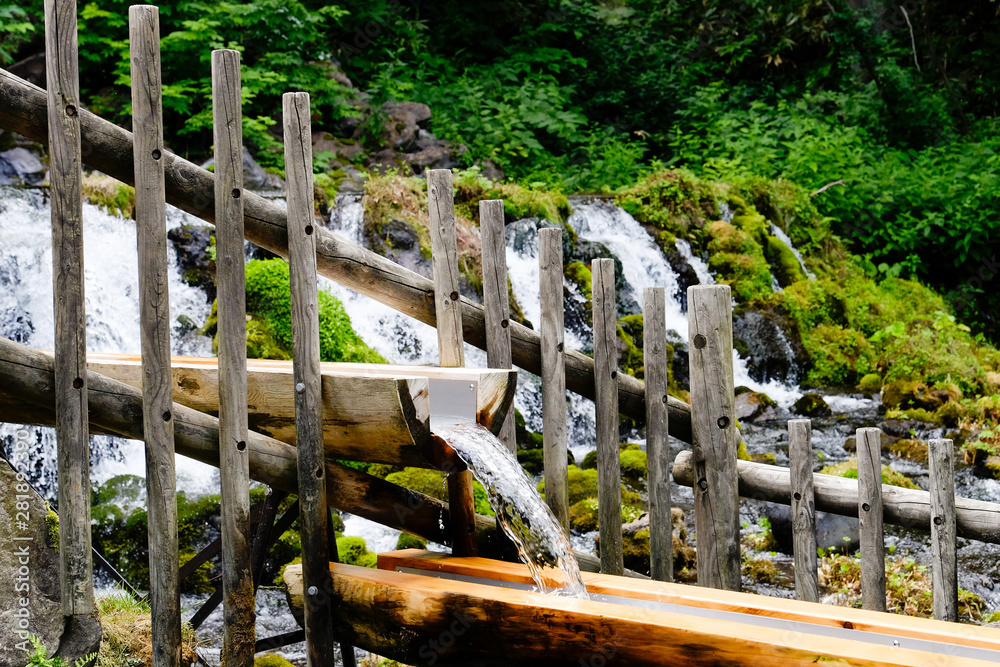 Natural bamboo gutter pile up as pipeline ,fresh water from waterfall ...