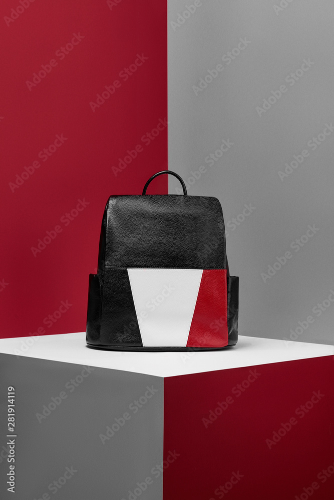 Photo of black leather backpack with white and red insertion on front ...