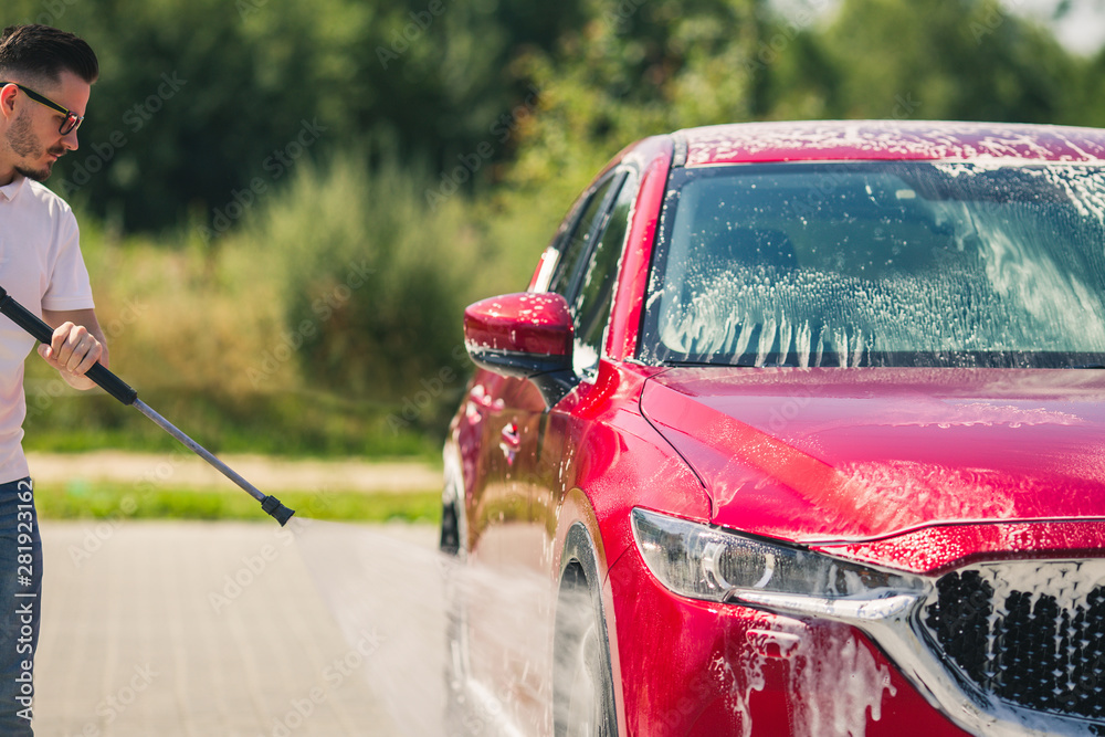 Manual car wash with pressurized water in car wash outside. Summer Car ...