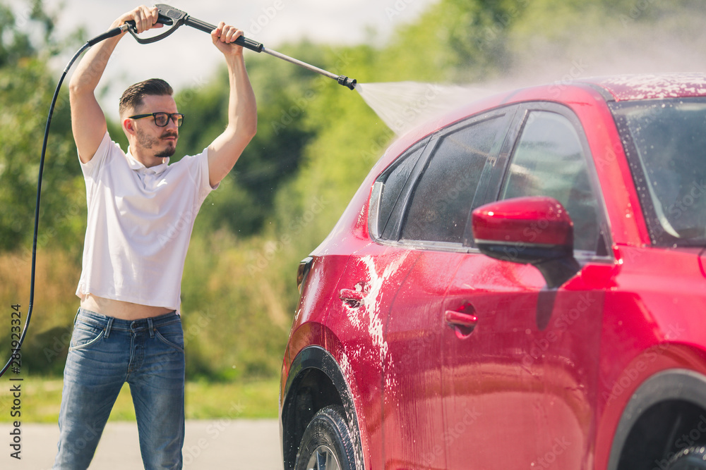 Manual car wash with pressurized water in car wash outside. Summer Car ...