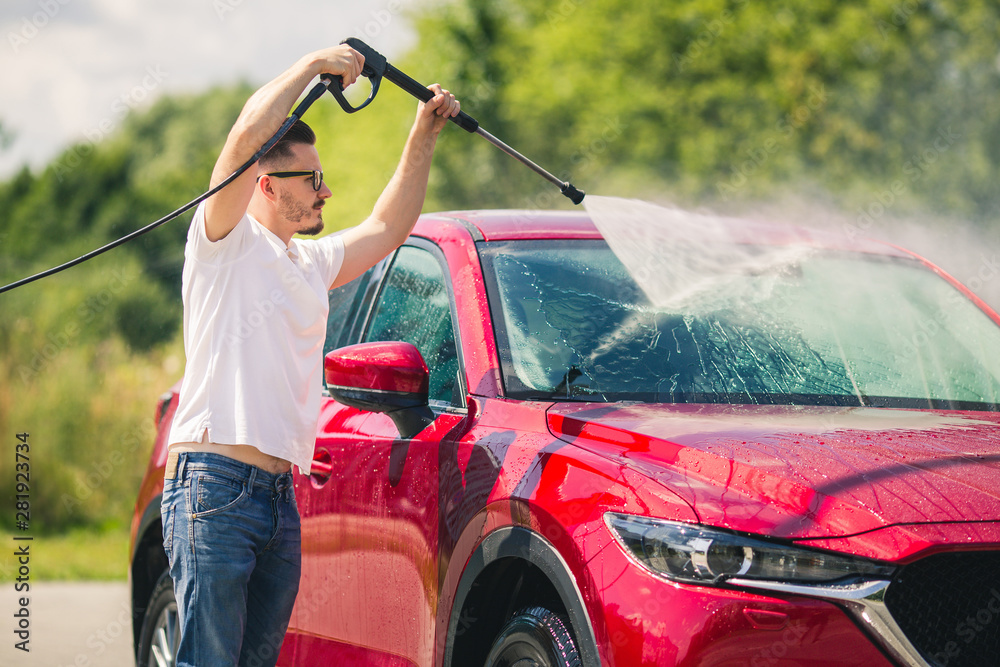 Manual car wash with pressurized water in car wash outside. Summer Car ...