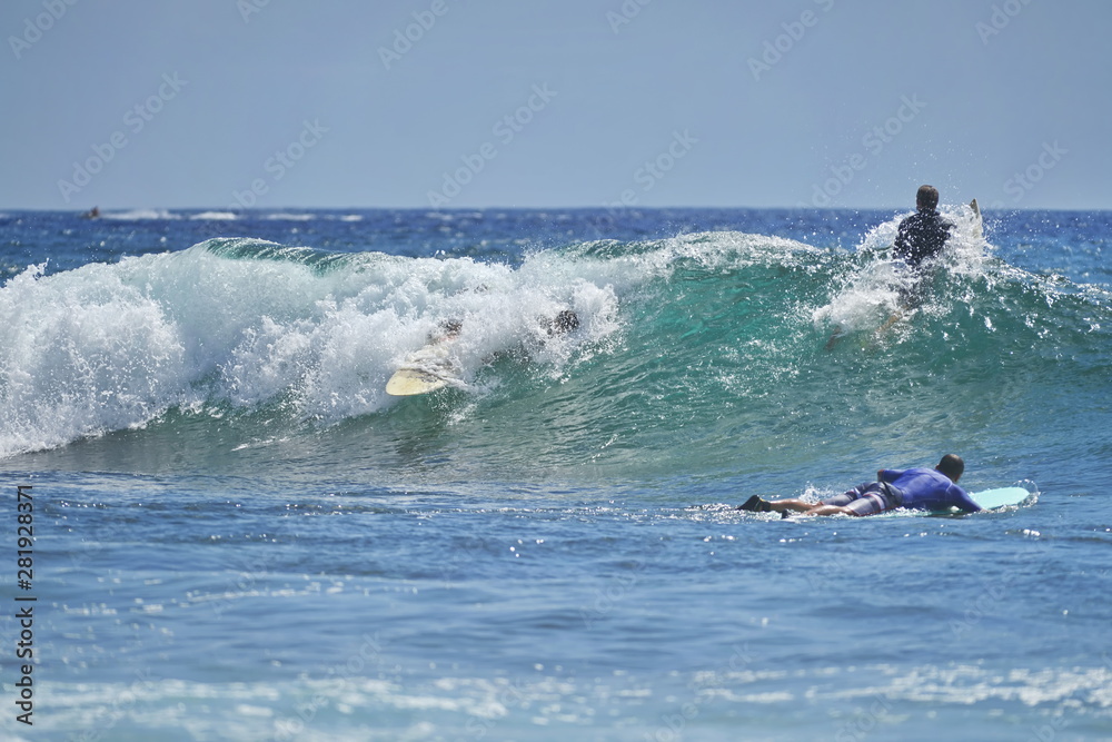 Young pro surfer surfs a big barrel wave in popular surf spot in ...