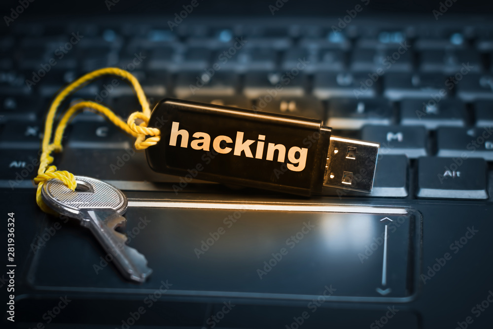 The concept of personal data cybersecurity. Flash drive labeled hacking ...