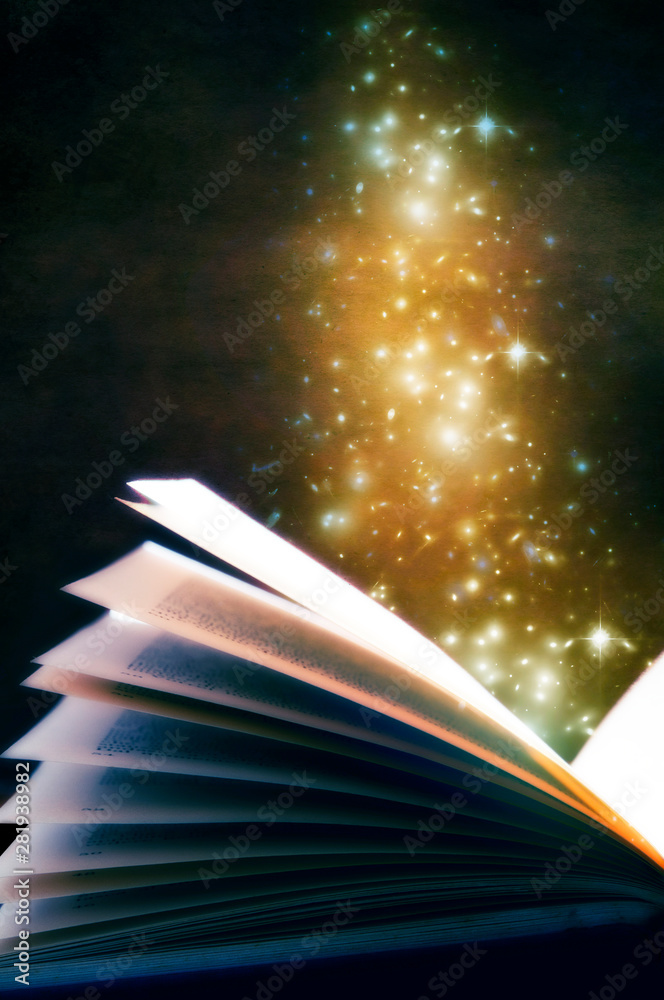 opened old magic magical esoteric book with gold stars over grunge ...