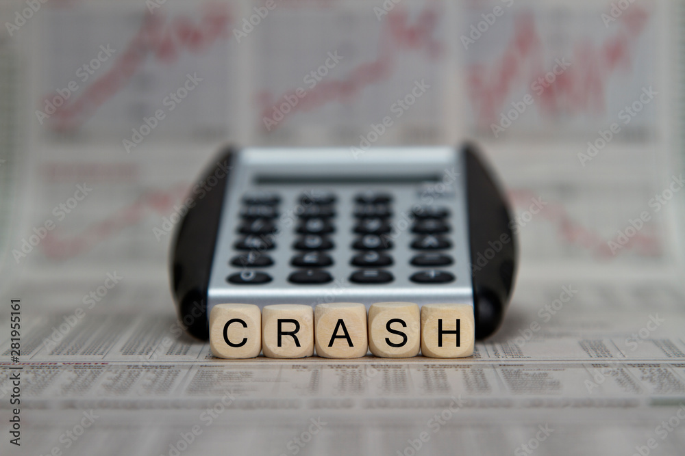 stock market crash word and calculator on a business newspaper ...