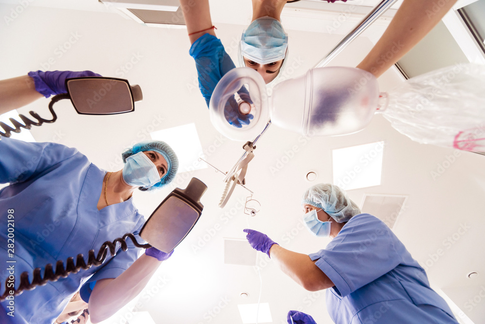 Doctors give resuscitation to a male patient in the emergency room ...