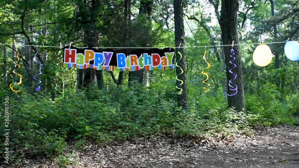 Happy Birthday sign panorama in the outdoor trees with balloons and ...