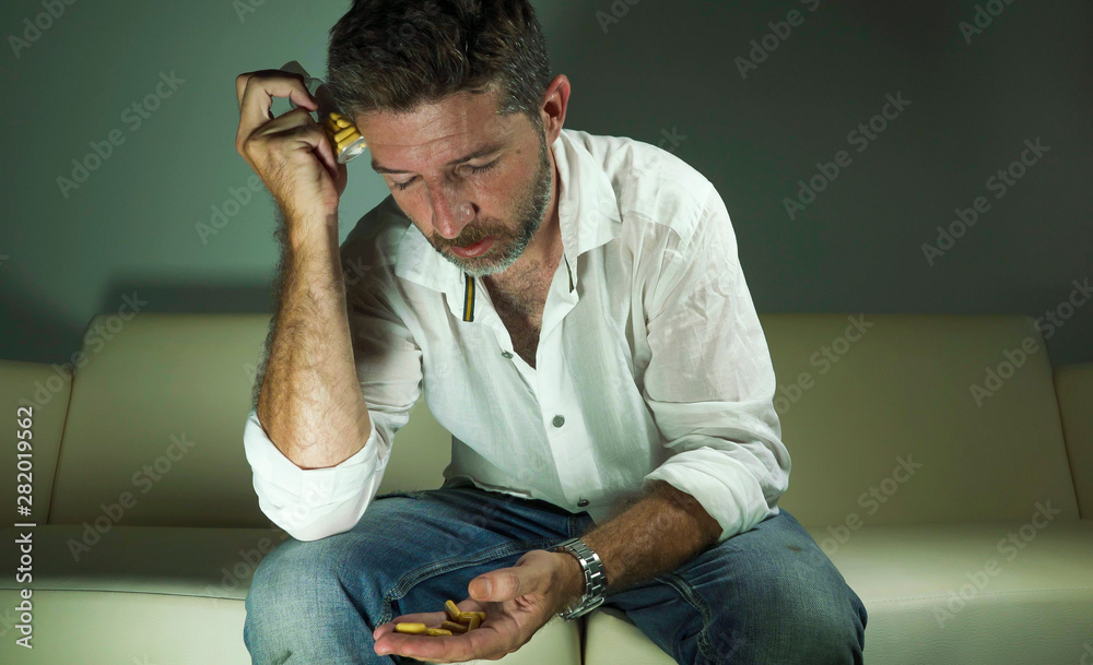 dramatic portrait of young attractive depressed and wasted pills addict ...
