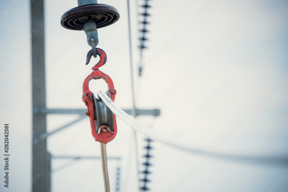 Construction process install aluminum electrical wires with insulators ...