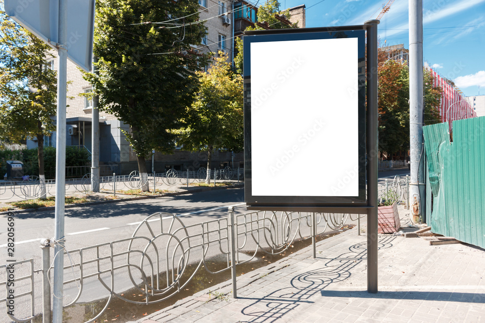 citylight with blank screen stands on the empty street near a ...
