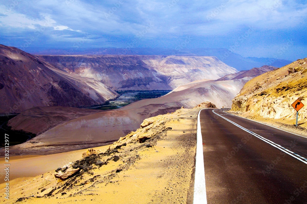 Highway through white dry barren salt valley Cordillera de la Sal (Salt ...