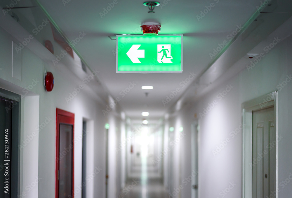 hallway in apartment with , door rooms in dorm Fire exit green light ...