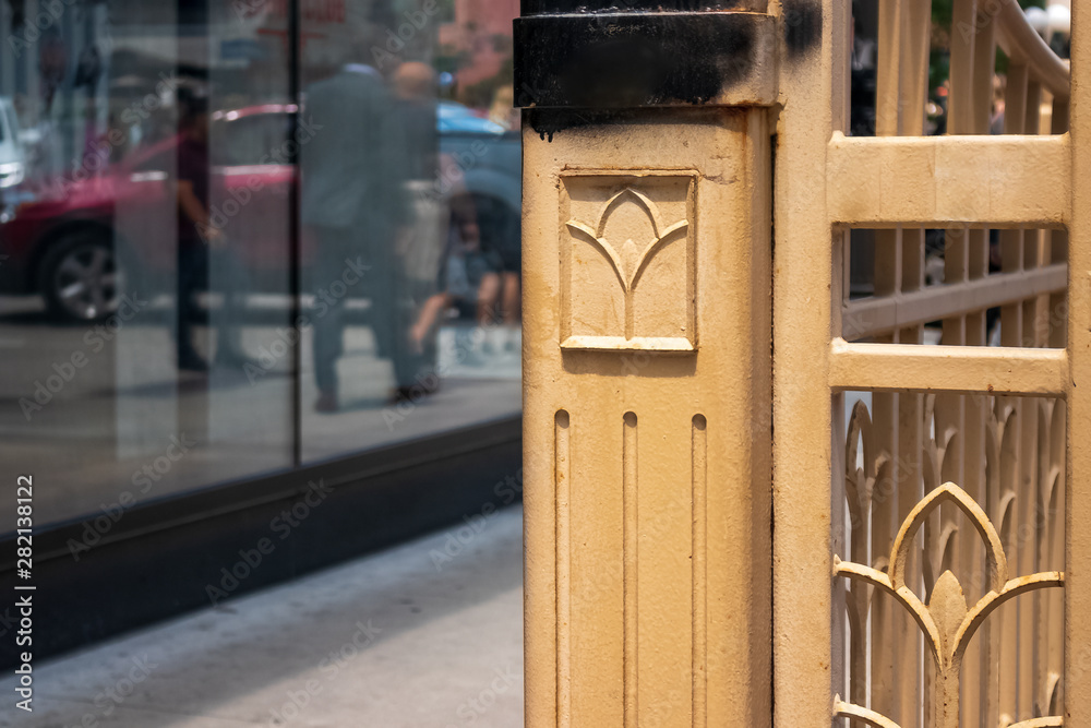 Design on gate around stairwell leading to Lower Wacker depicting the Y ...