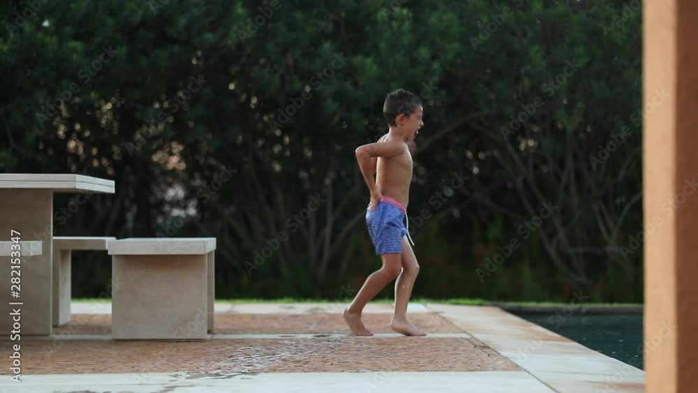 Silly Little boy acting goofy dancing and grimacing around at the ...