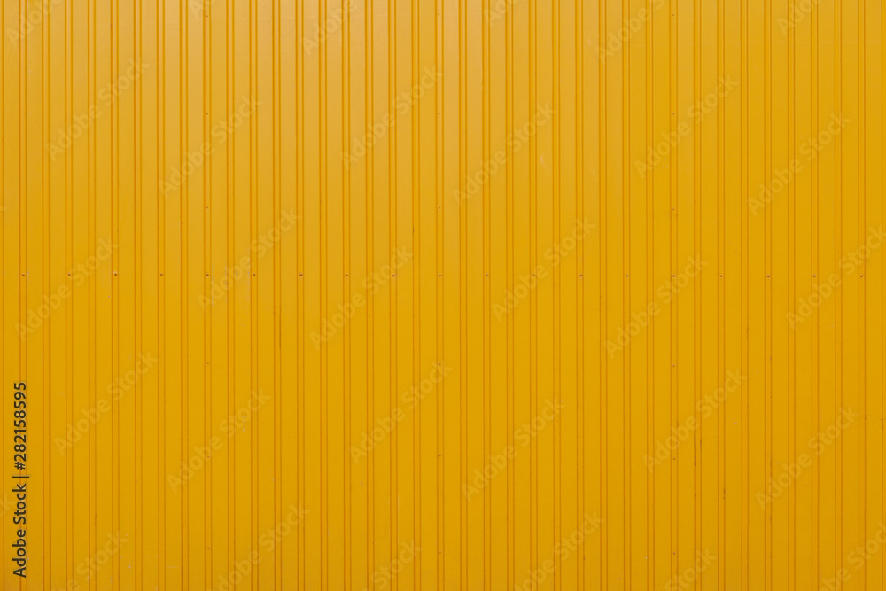 Yellow metal sheet panel or cladding with vertical line wave pattern ...