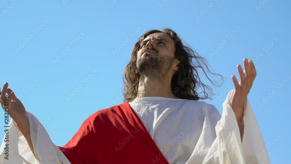 Jesus raising hands to heaven, asking father for help and mercy ...