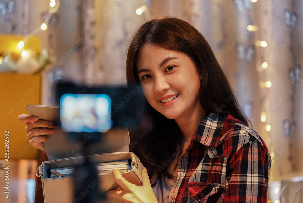 Vlogger Asian Woman happiness while make money vlogging online with a ...